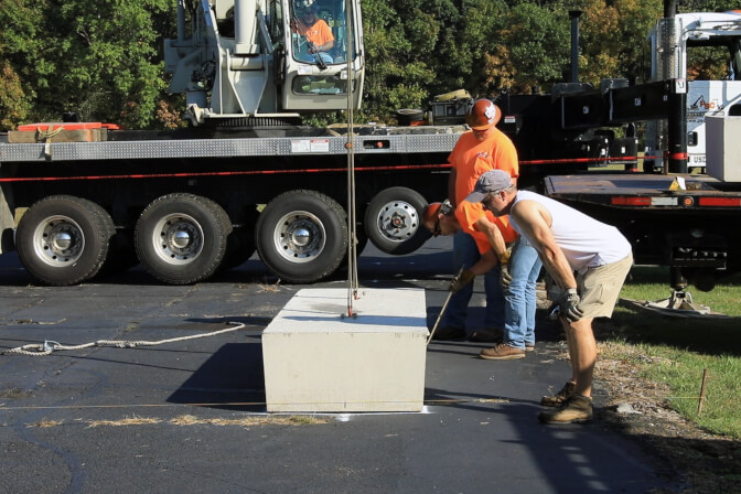 Cement ballast blocks installation for a solar array - OGW Energy Resources